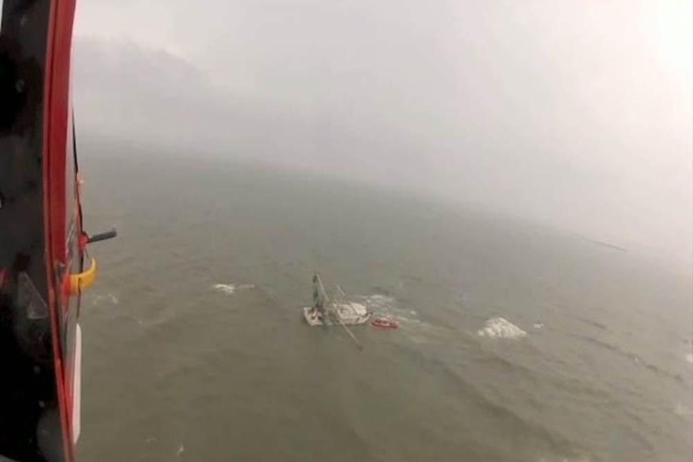 DVIDS - Video - Coast Guard Rescues Three Mariners from Sinking Vessel