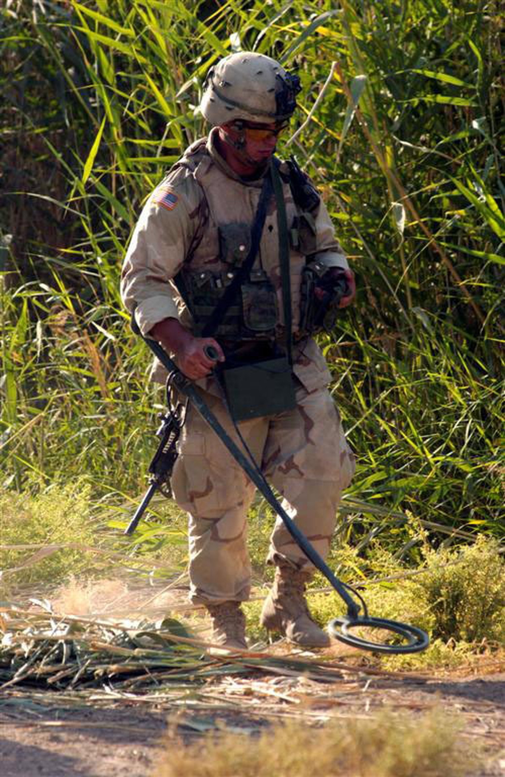 DVIDS - Images - A Soldier searches the area for weapon caches using a ...