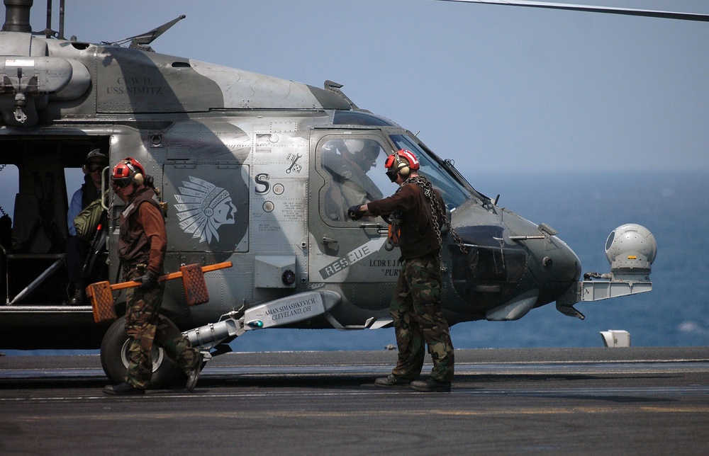 DVIDS - Images - Sailors prepare helicopter for lift-off from USS Nimitz