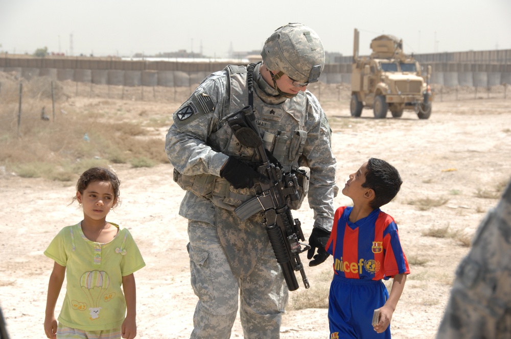 DVIDS - Images - 10th Mountain Soldier Walks With Iraqi Boy DVIDS - Images - 10th Mountain Soldier Walks With Iraqi Boy