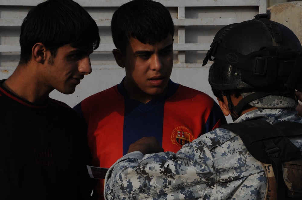 DVIDS - Images - Iraqi national police, U.S. Soldiers hand out ...