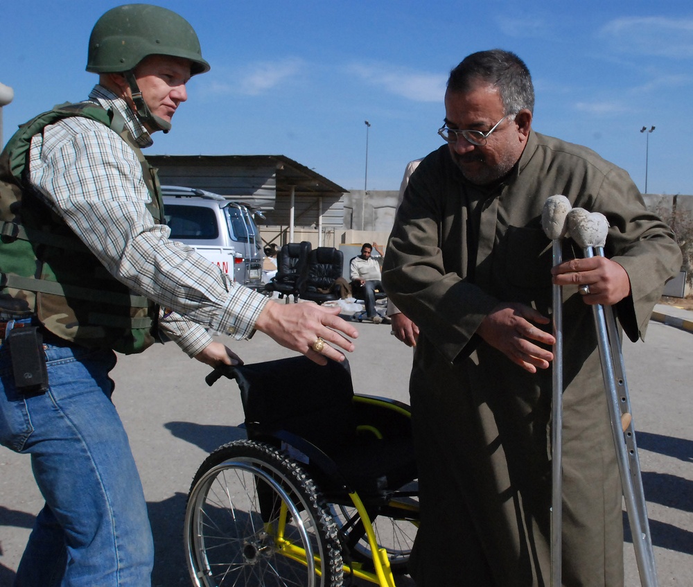 DVIDS - Images - Striker Soldiers, charity group distribute wheelchairs ...