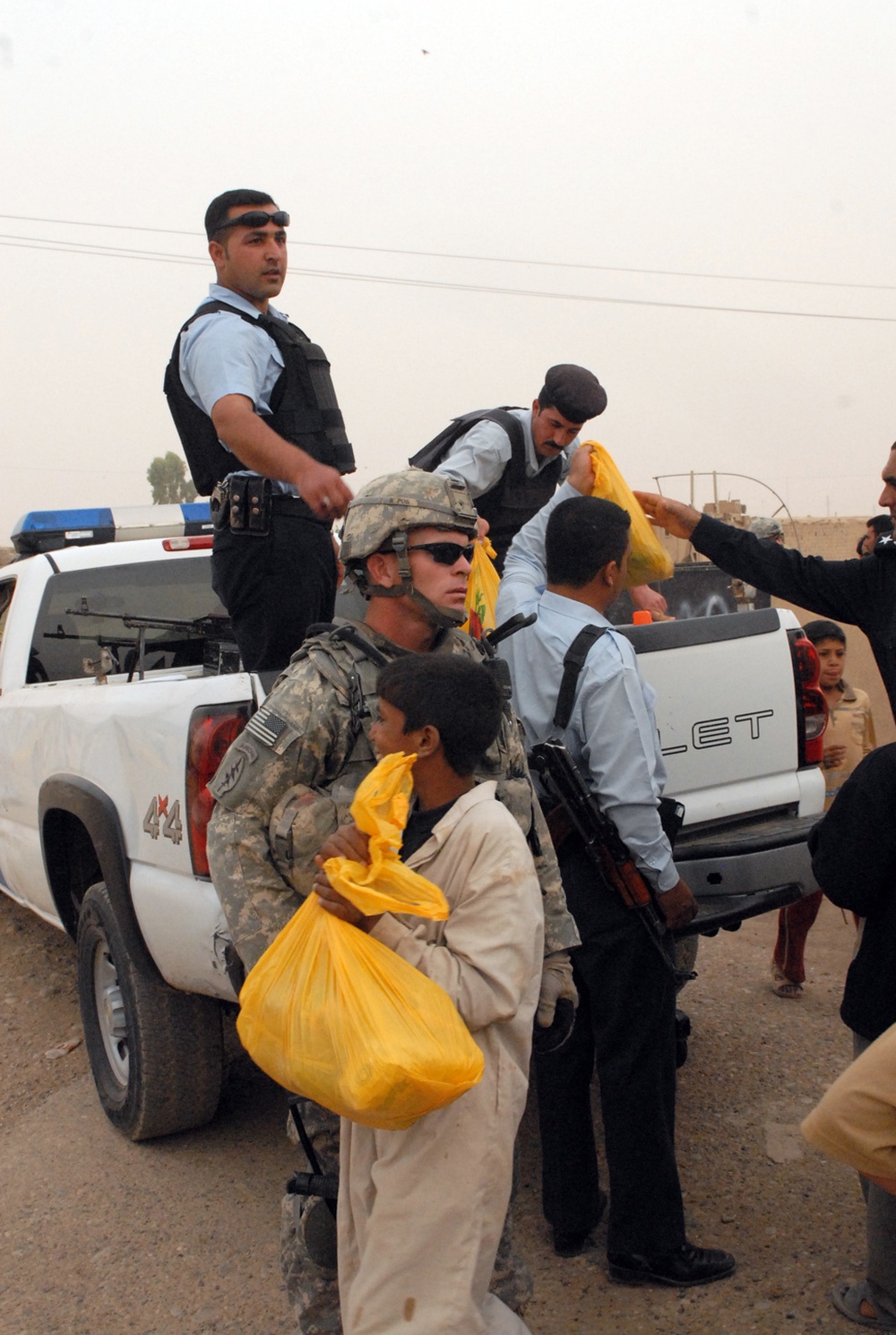 DVIDS - News - Iraqi and U.S. Soldiers deliver food, soccer balls in ...
