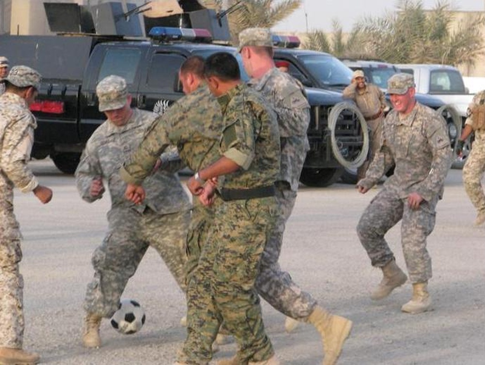 DVIDS - News - Iraqi, U.S. Soldiers pass the ball and pass some time