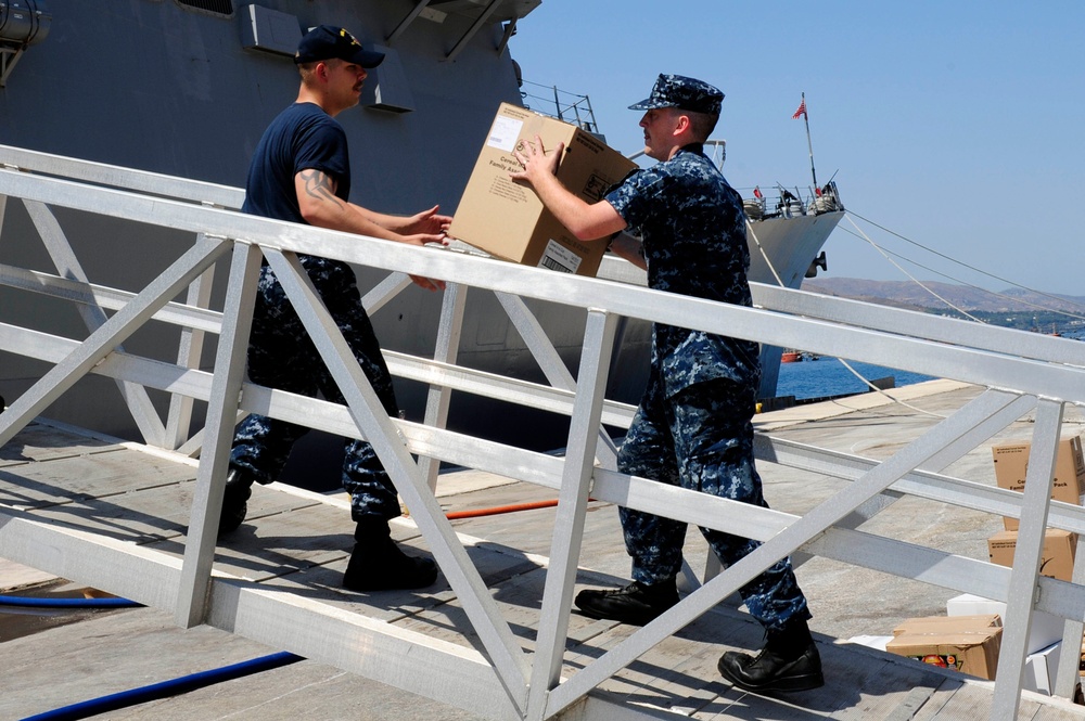 DVIDS - Images - Sailors bring supplies to USS Farragut [Image 2 of 2]