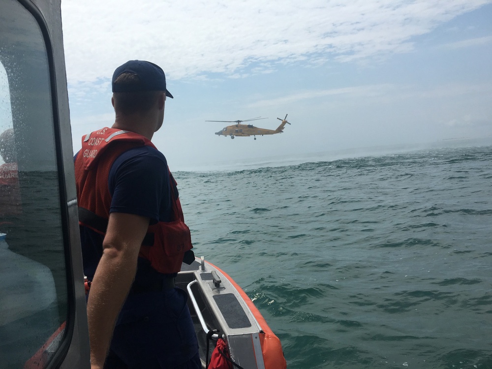 Dvids Images Coast Guard Rescues 2 From Sinking Boat Near