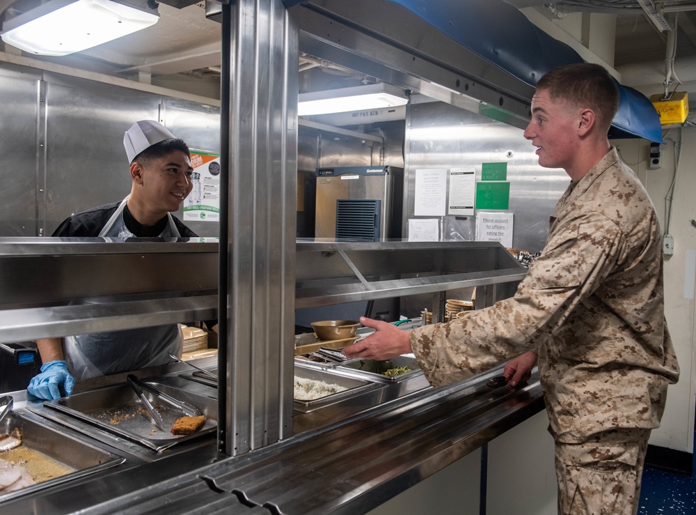 DVIDS - Images - Marine Serves Food Aboard USS Harpers Ferry [Image 3 of 5]