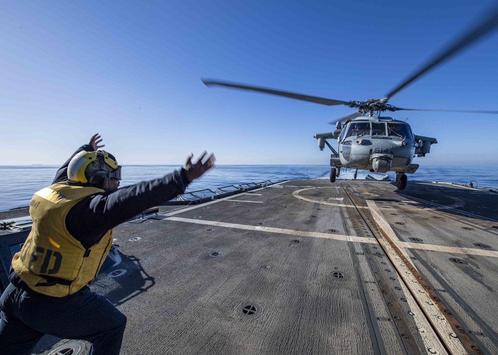 DVIDS - Images - USS Normandy Sailor Directs MH-60S Sea Hawk Helicopter [Image 4 of 4]