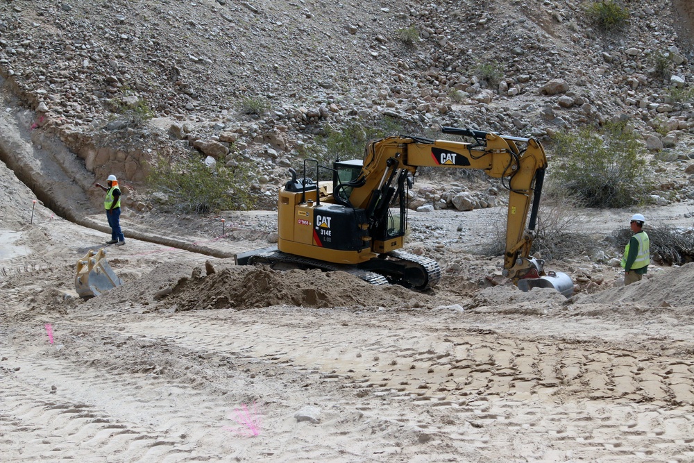 DVIDS - Images - Workers trench an area where barrier panels will be ...