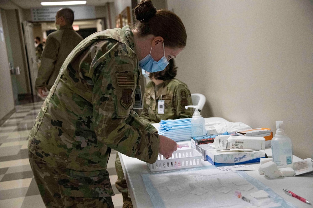 DVIDS - News - 97 MDG administers their first COVID-19 vaccines