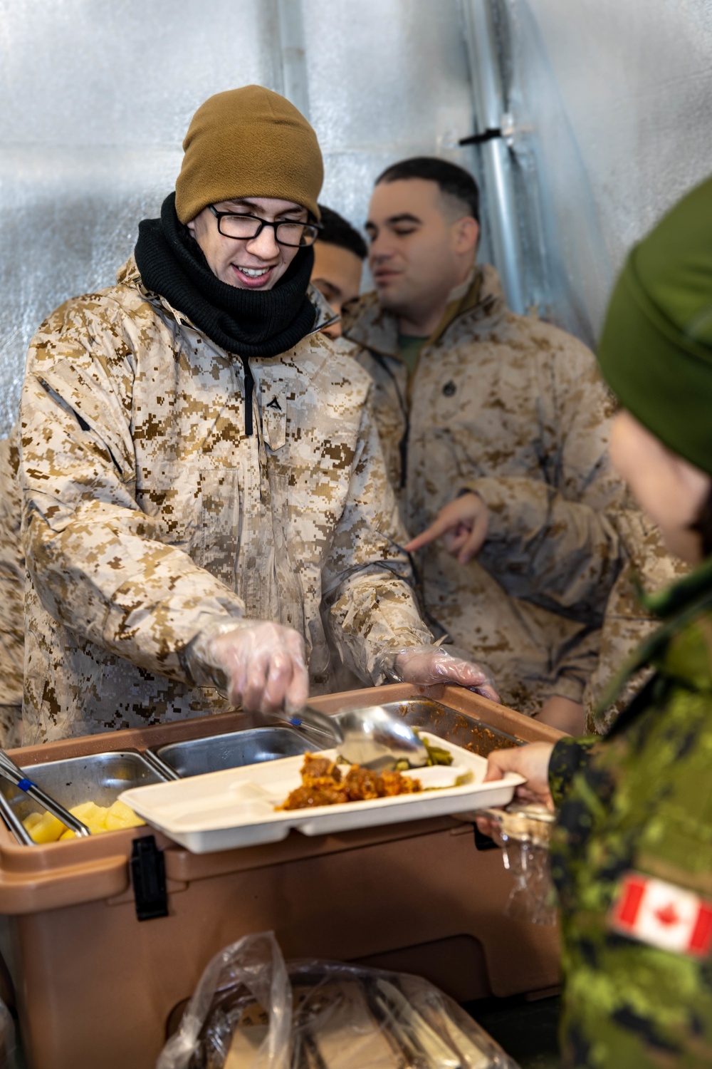 DVIDS - Images - 2nd LSB Marines feed Canadian Army Soldiers [Image 5 of 5]