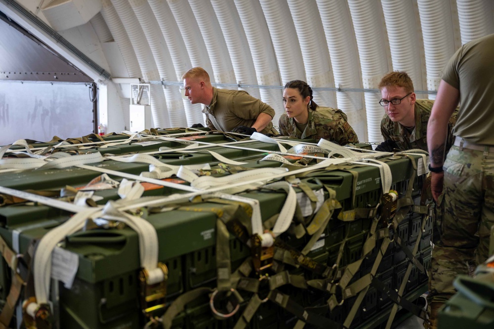 DVIDS - Images - 721st APS and 86th LRS Airmen load ammunition, cargo ...