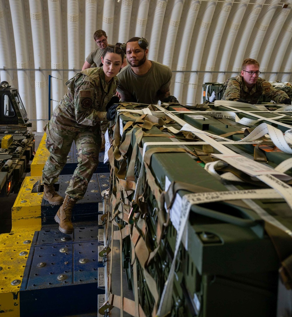 DVIDS - Images - 721st APS and 86th LRS Airmen load ammunition, cargo ...