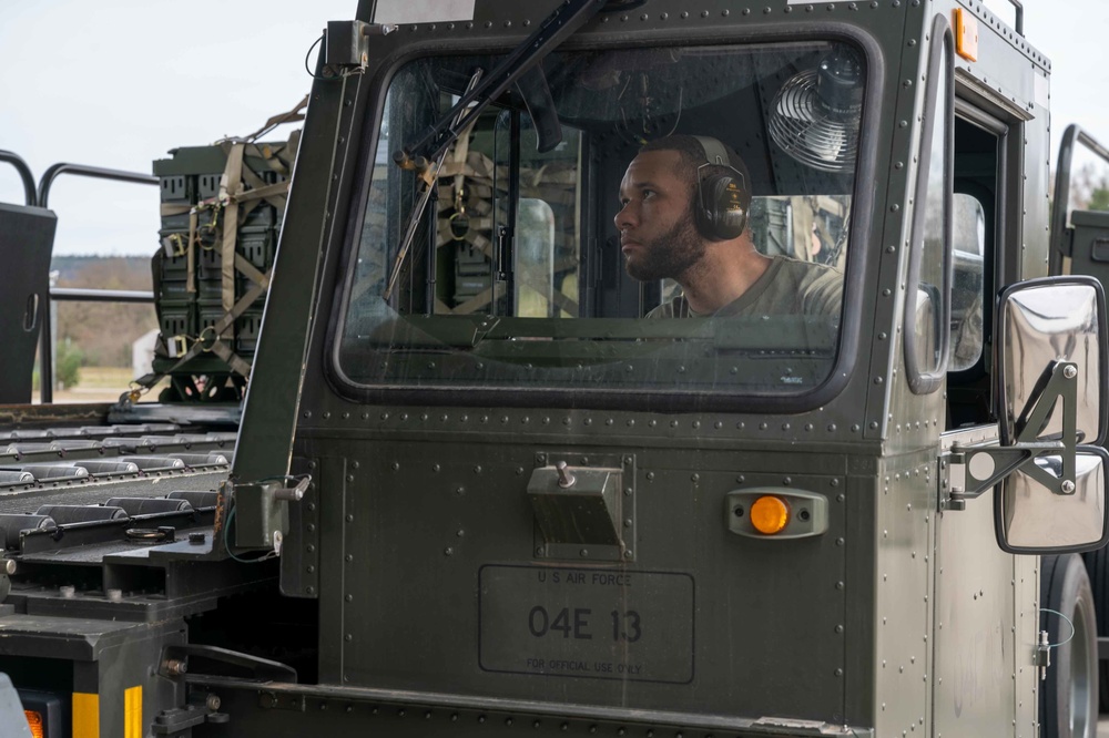 DVIDS - Images - 721st APS and 86th LRS Airmen load ammunition, cargo ...