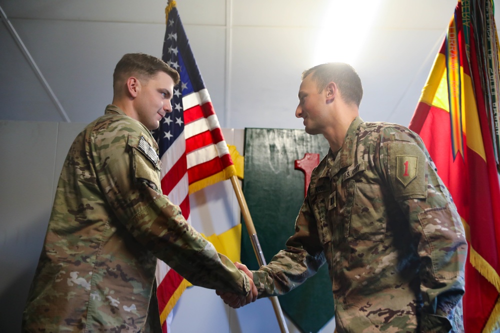 DVIDS - Images - HHB, 1st DIVARTY XO promotes, re-enlists Soldier ...