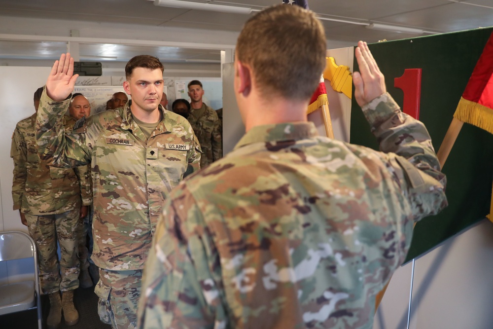 DVIDS - Images - HHB, 1st DIVARTY XO promotes, re-enlists Soldier ...