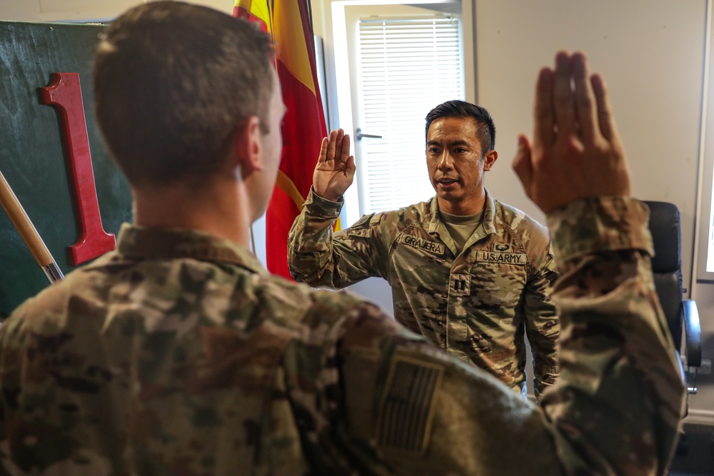 DVIDS - Images - HHB, 1st DIVARTY XO promotes, re-enlists Soldier ...