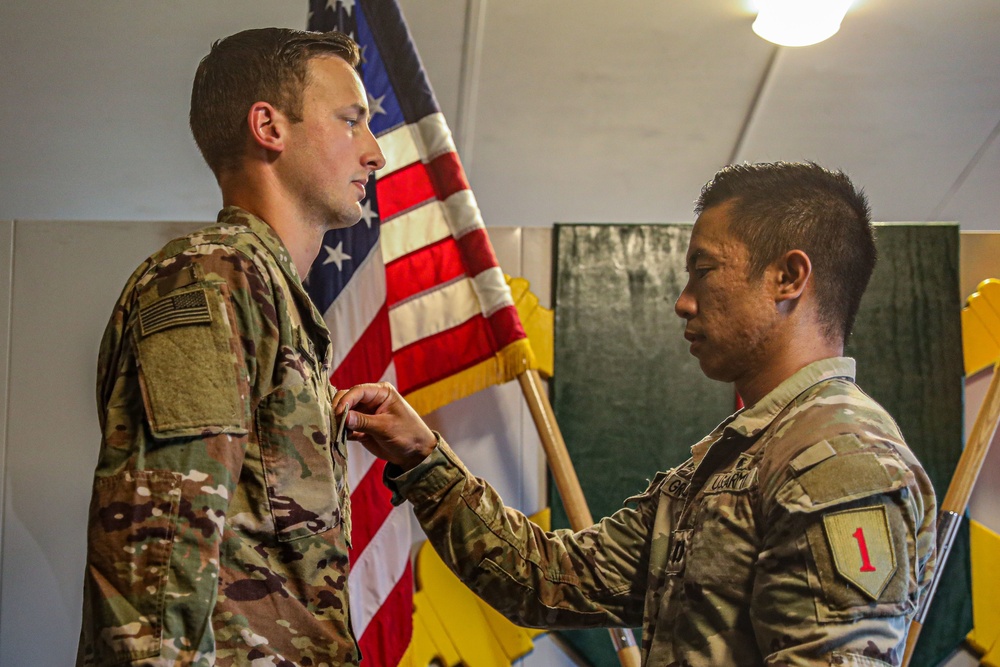 DVIDS - Images - HHB, 1st DIVARTY XO promotes, re-enlists Soldier ...