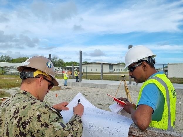 DVIDS - Images - Builder 2nd Class Ethan Adams reviews blueprints with ...