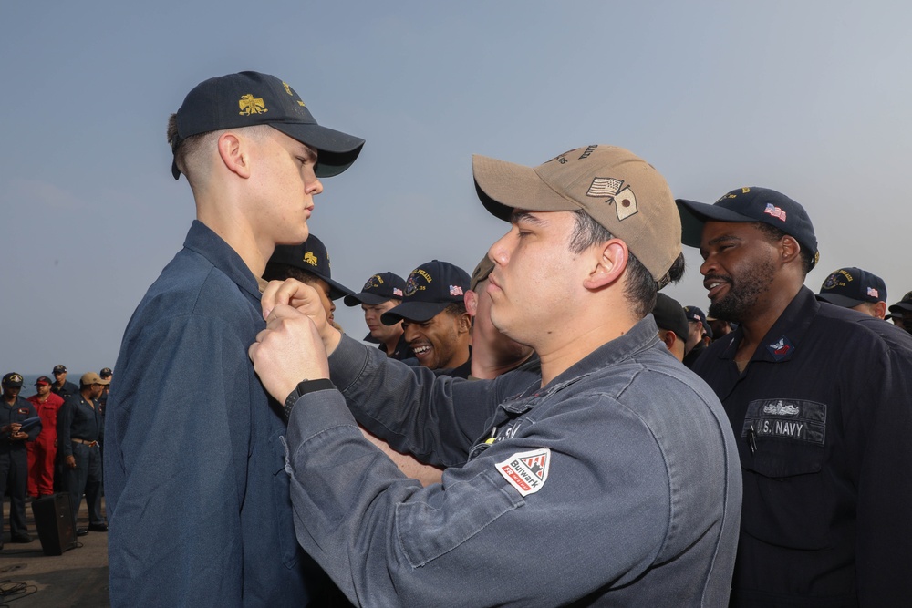 DVIDS - Images - Sailors aboard the USS Rafael Peralta (DDG 115) hold a ...