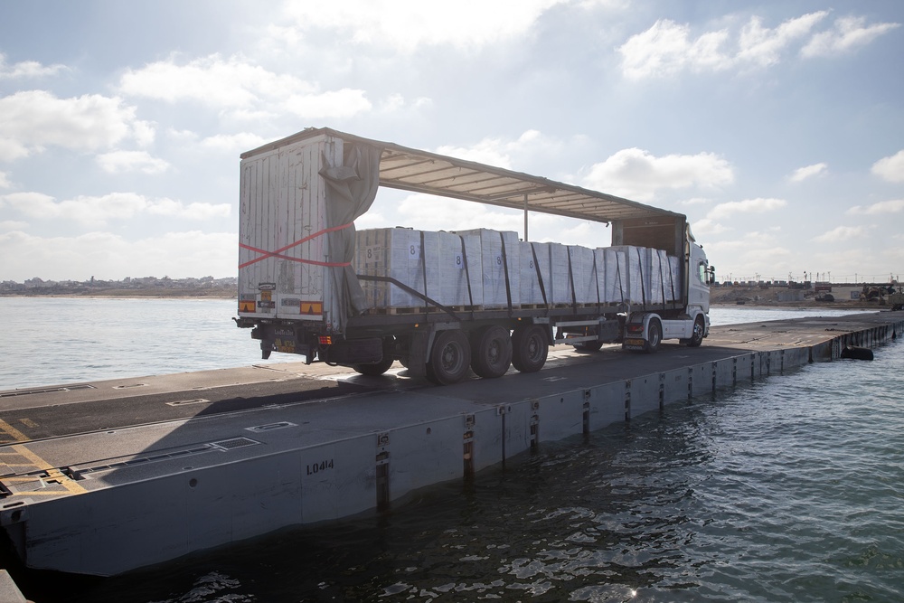 DVIDS - Images - Aid delivered across Trident Pier [Image 1 of 4]