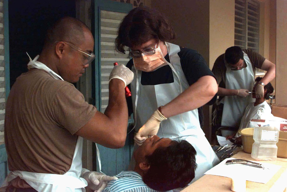 DVIDS - Images - Staff Sgt. Castillo assists Maj. Cleereman as she ...