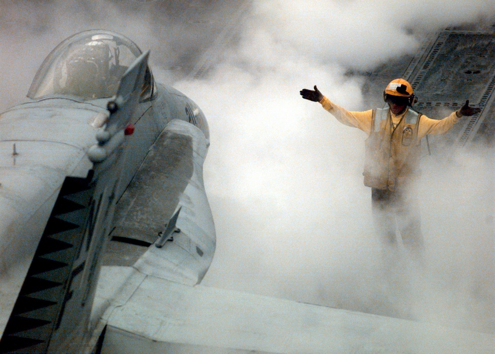 DVIDS - Images - A flight deck handler is engulfed in steam as he ...
