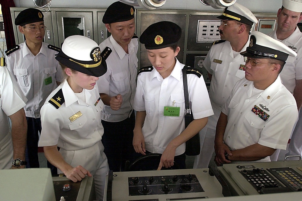 DVIDS - Images - Lt. j.g. Weihua Hu shows Ensign Kathleen Merkle the helm of the Chinese warship ...