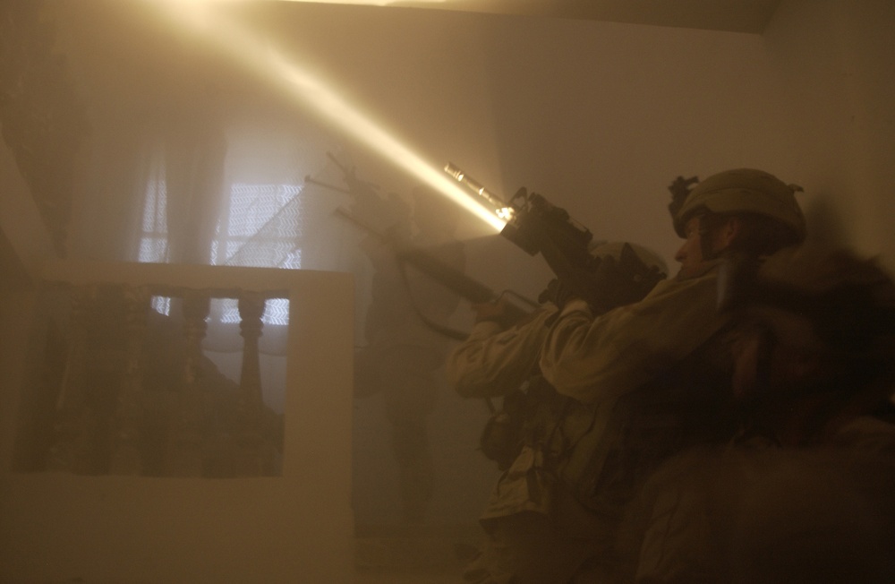 DVIDS - Images - The beam of a flashlight fastened to a rifle cuts ...