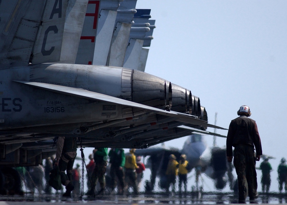 DVIDS - Images - A plane captain walks behind the after burners of F/A ...