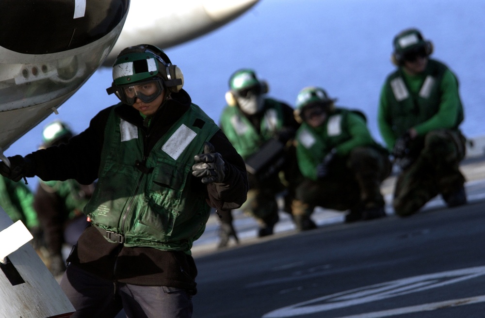 DVIDS - Images - A U.S. Navy airmen directs an E-2C Hawkeye into launch ...