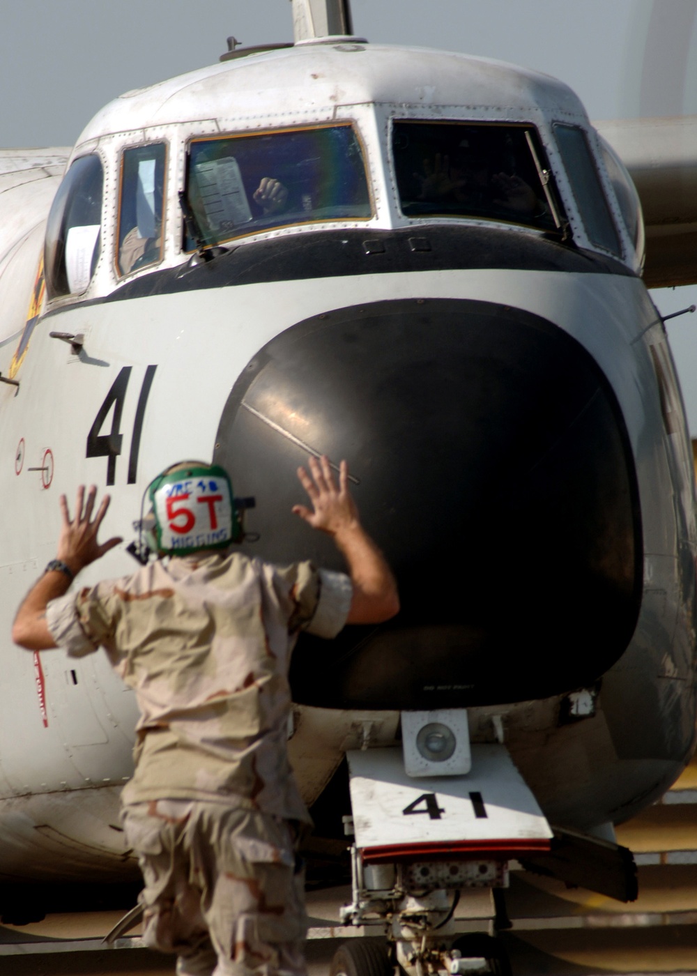 DVIDS - Images - Navy Petty Officer 2nd Class Michael Higgins signals ...