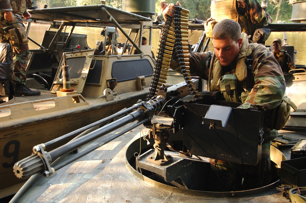 DVIDS - Images - Seaman Apprentice Sean Costello loads a .50-caliber ...