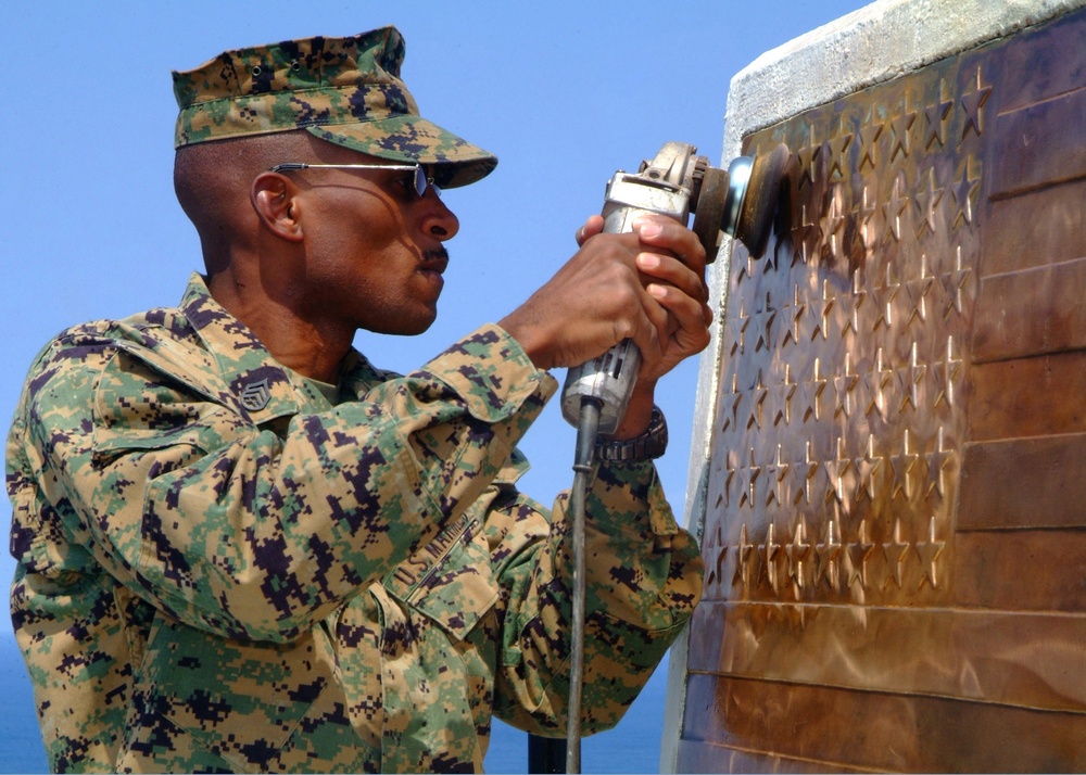 DVIDS - Images - Staff Sgt. Andrew C. Edwards polishes a Marine Corps ...