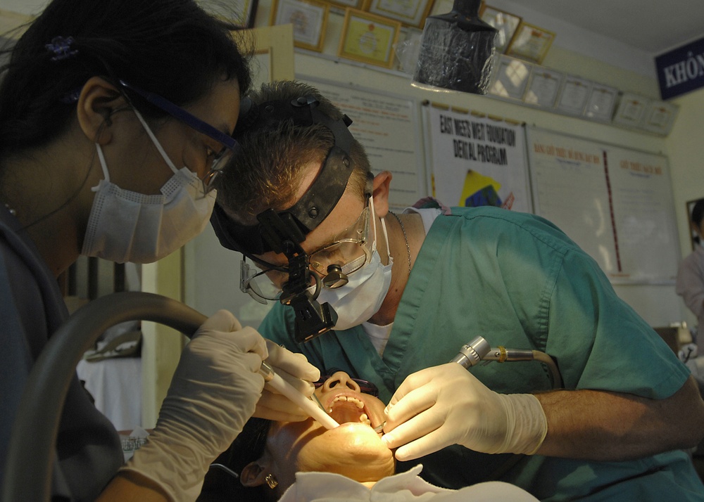 DVIDS - Images - Lt. Kevin Haveman cleans the teeth of a Vietnamese woman.