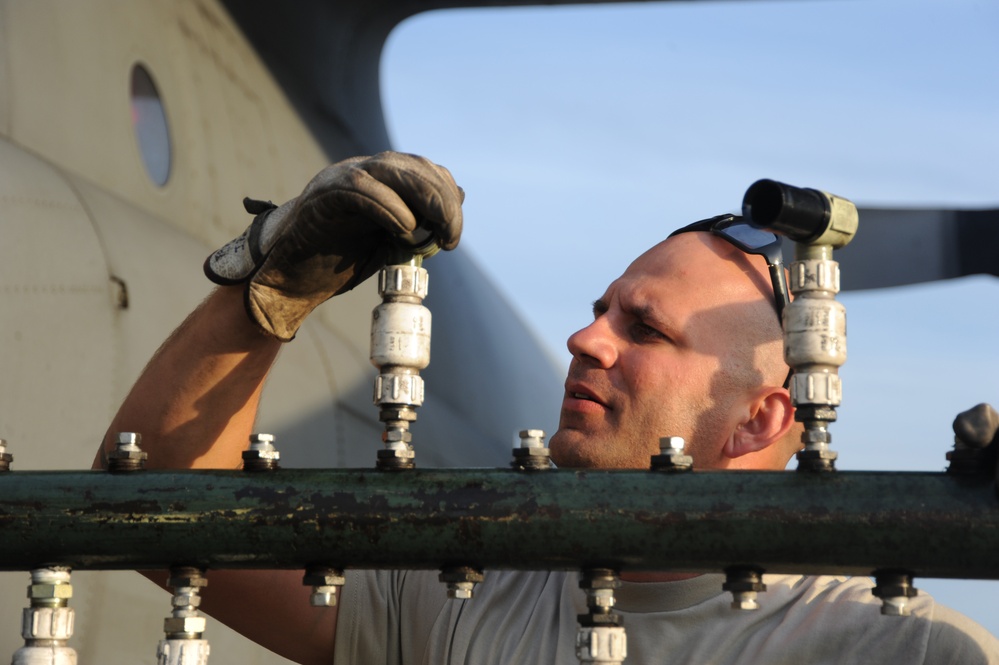 DVIDS - Images - Staff Sgt. Jeremy Rogers inspects the sprayer on a C ...